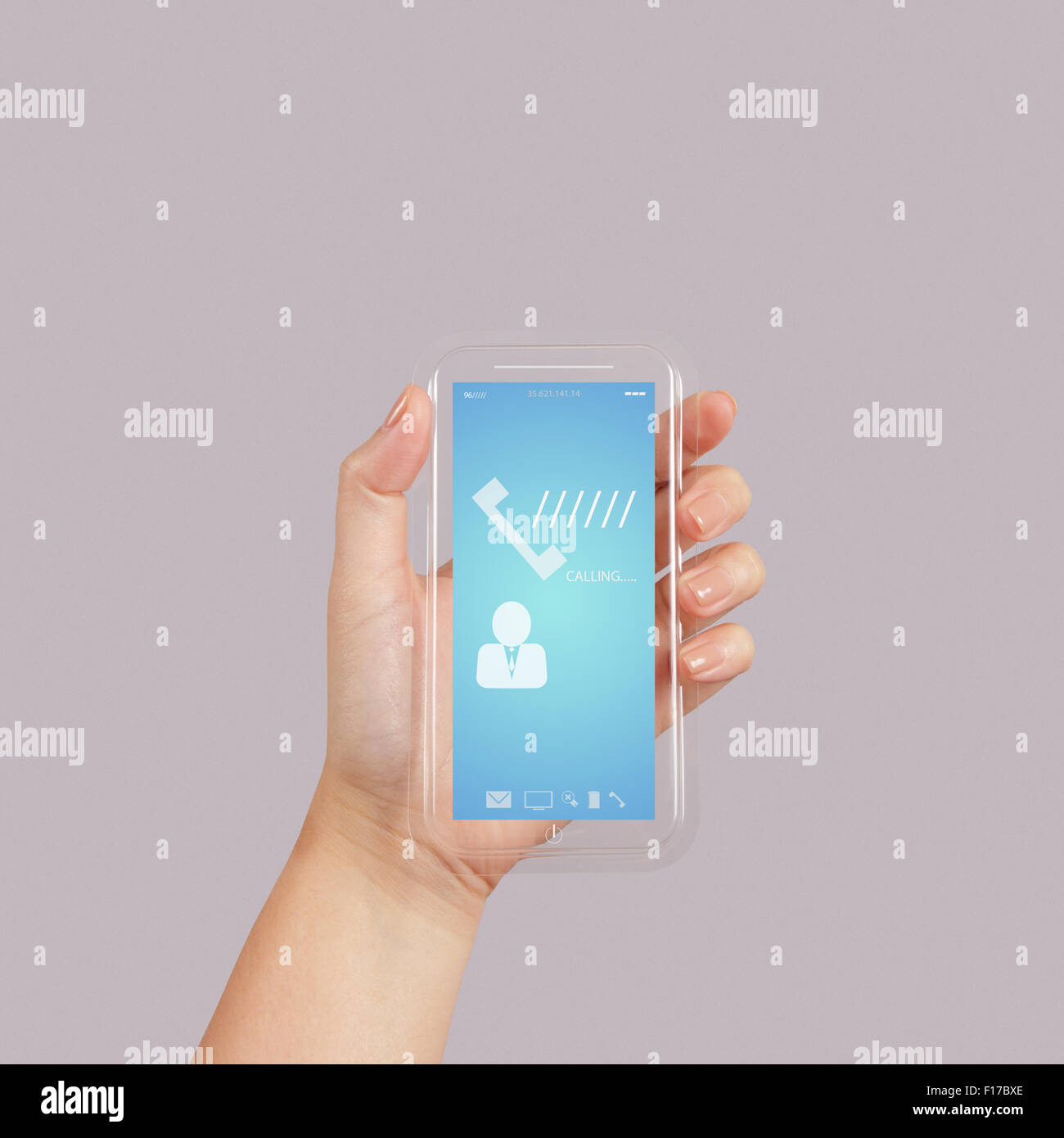 hand holding a touch phone with blue screen and the phone ringing icon ...