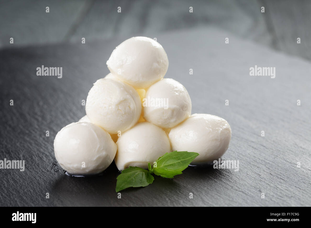 mozzarella balls on slate board Stock Photo - Alamy