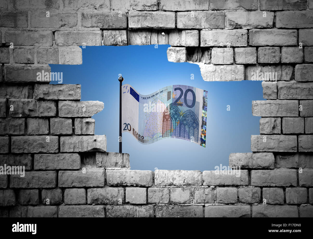 A hole in a crumbling brick wall revealing a twenty Euro banknote Stock ...