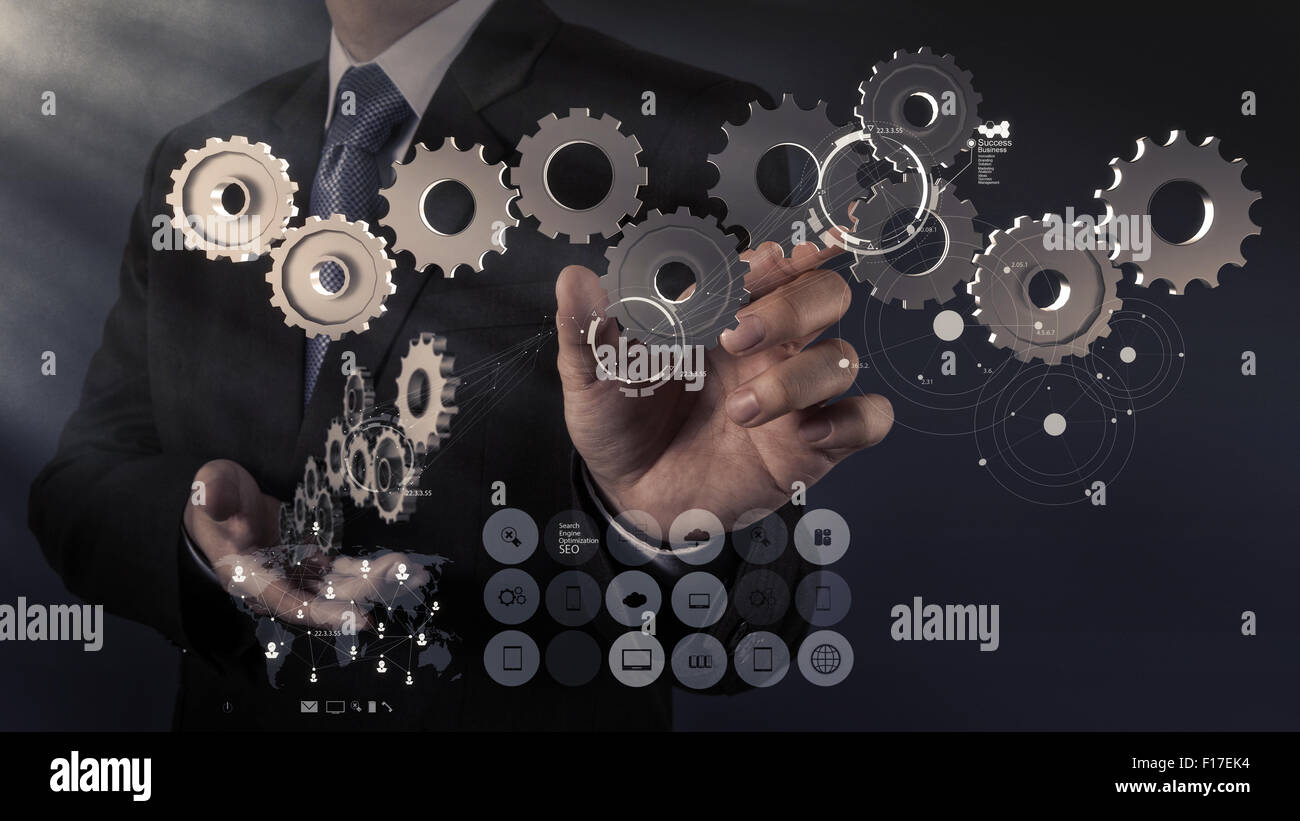 businessman hand show gear to success as concept Stock Photo - Alamy