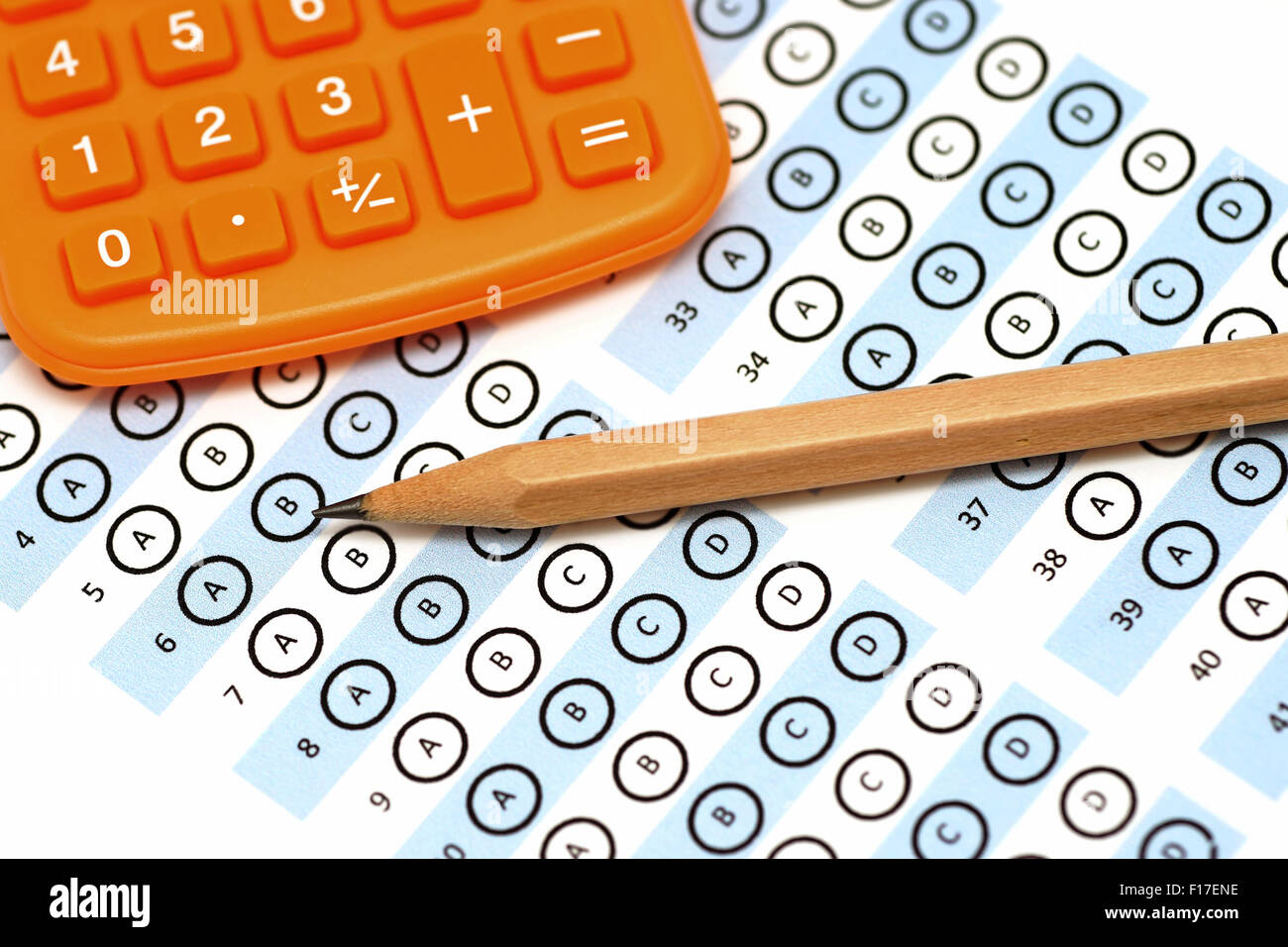 answer sheet test score with pencil and calculator Stock Photo - Alamy