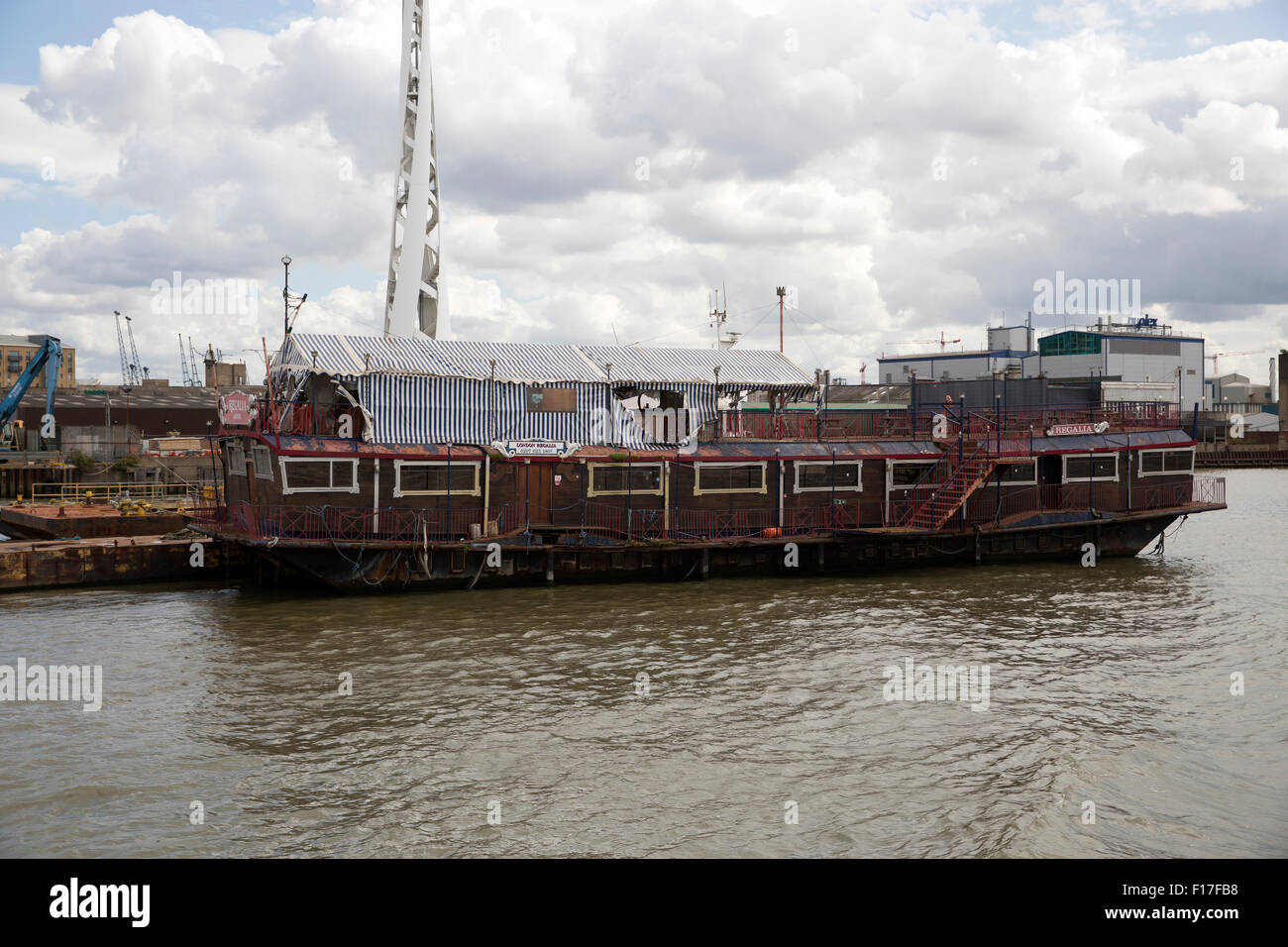 Disused and rundown floating restaurant on the River Thames in London ...