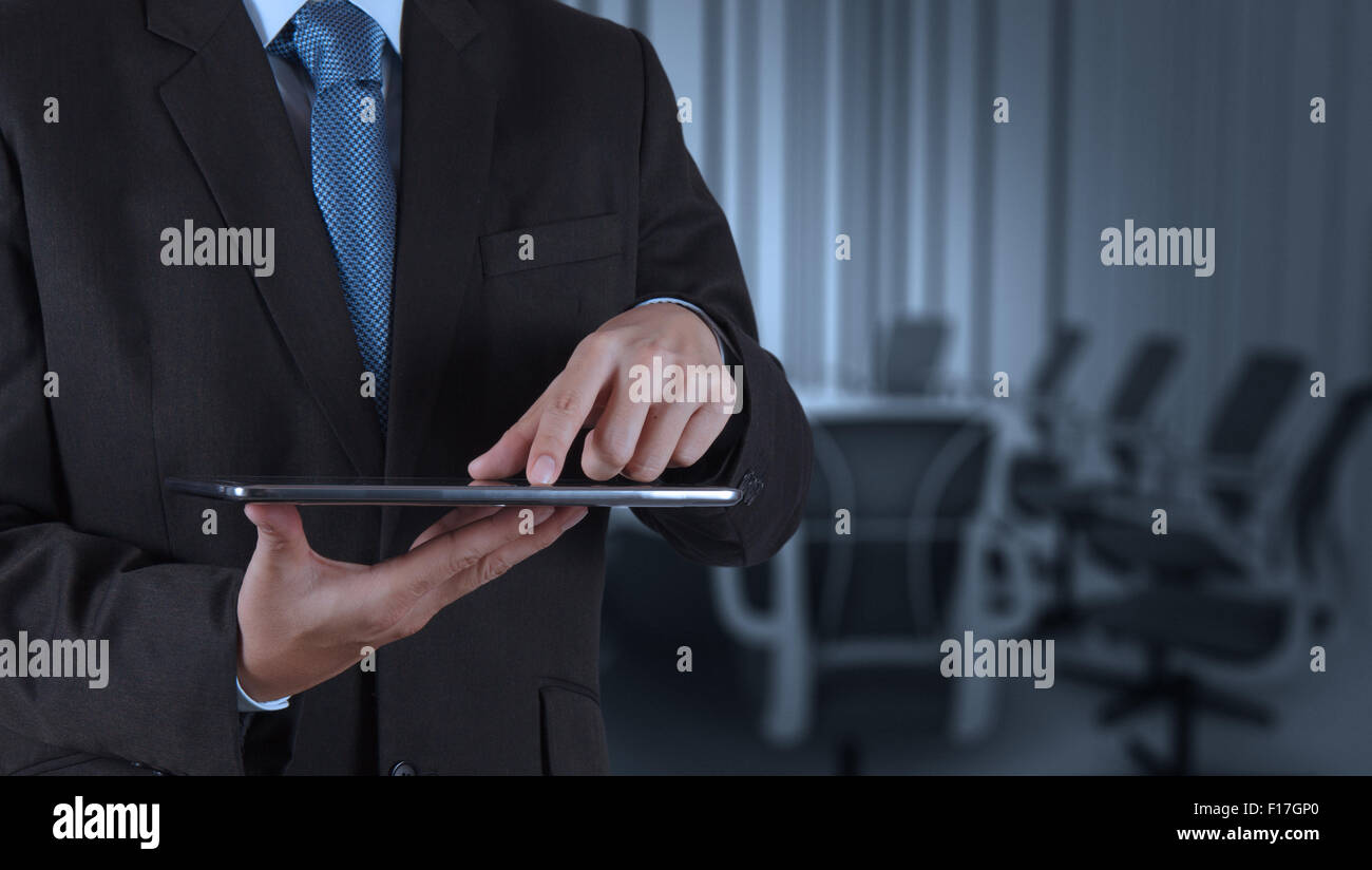 businessman hand using tablet computer and board room background Stock ...