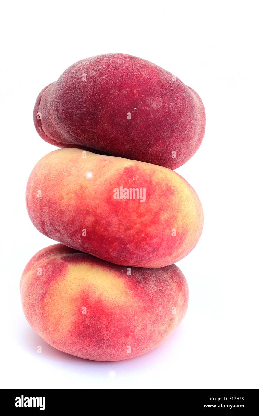 on a white background peaches stand on each other Stock Photo - Alamy