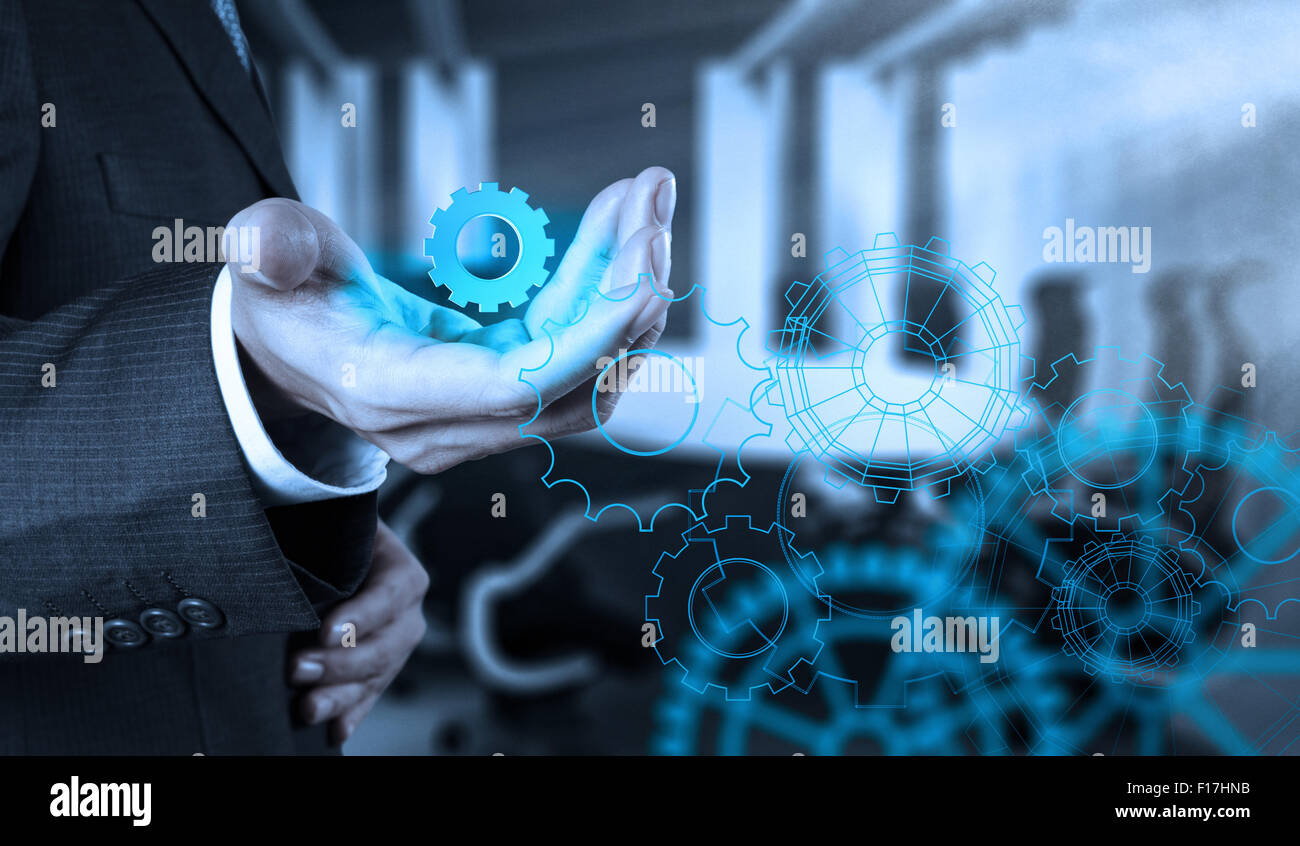 businessman hand draws gear to success concept Stock Photo - Alamy