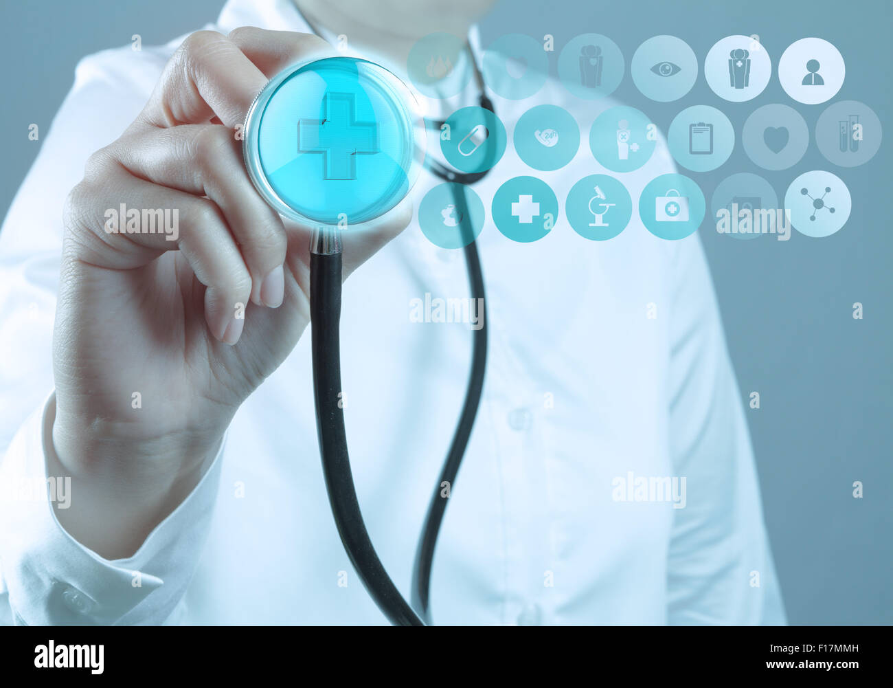 Doctor hand with a stethoscope and human sign social Stock Photo - Alamy