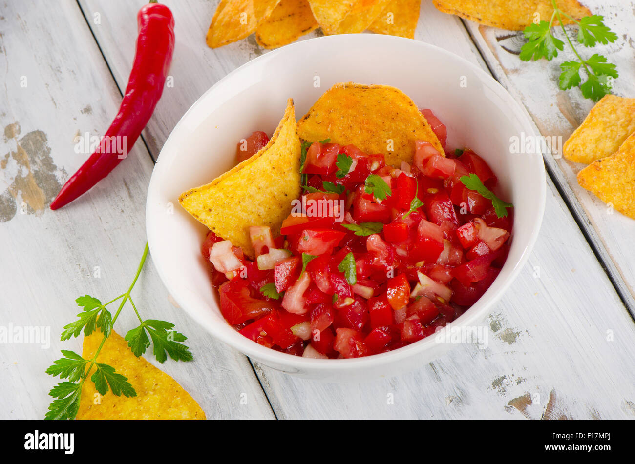 Bowl of healthy salsa dip with chips. Top view Stock Photo - Alamy