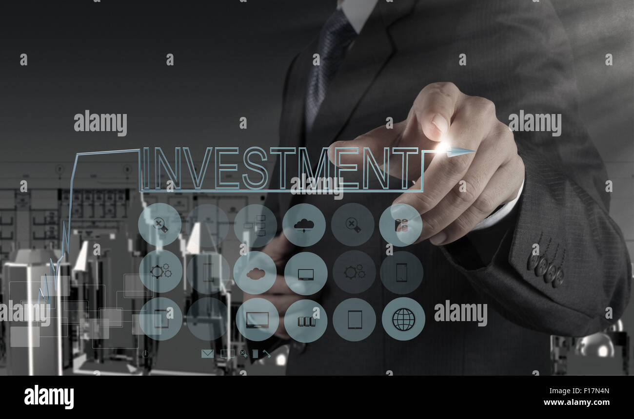 businessman hand pointing to investment concept Stock Photo - Alamy
