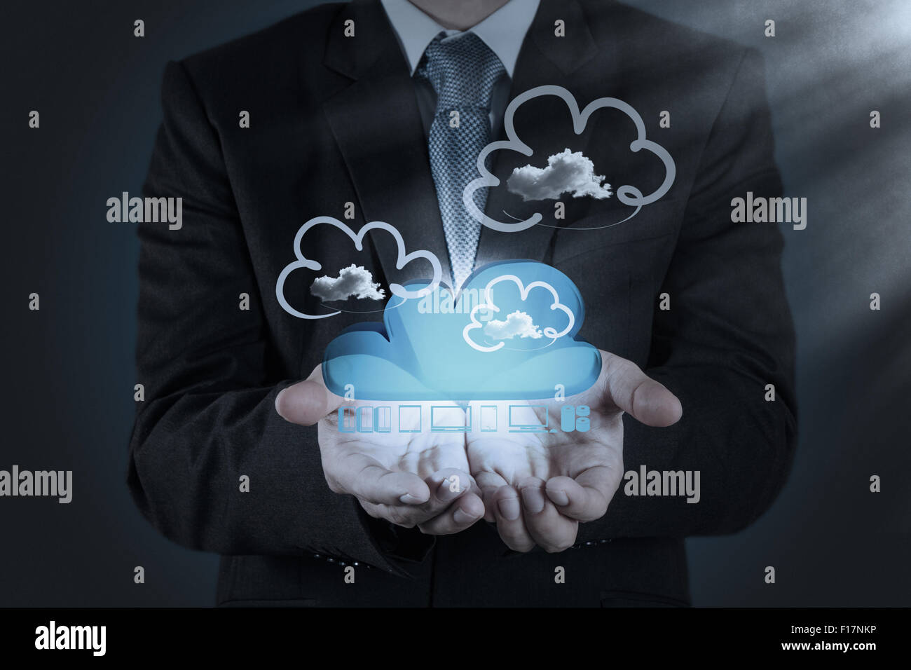 Businessman drawing a Cloud Computing diagram on the new computer ...