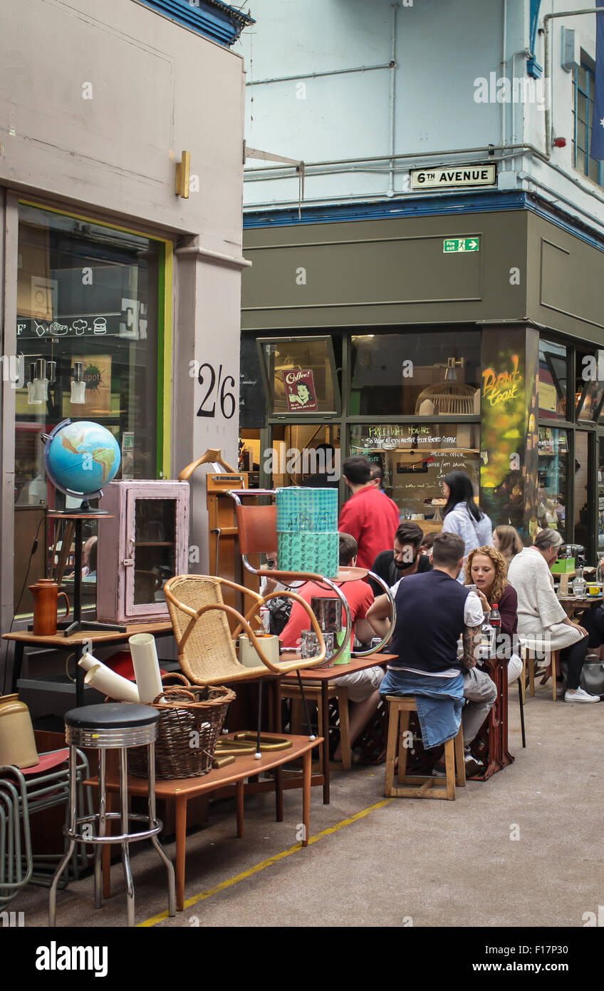 Brixton Village market, London, UK. People enjoy food and drink in ...