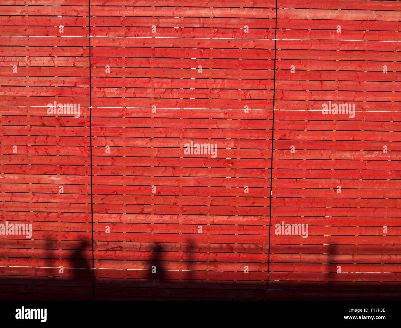 The silhouette of people against a bright red background Stock Photo ...