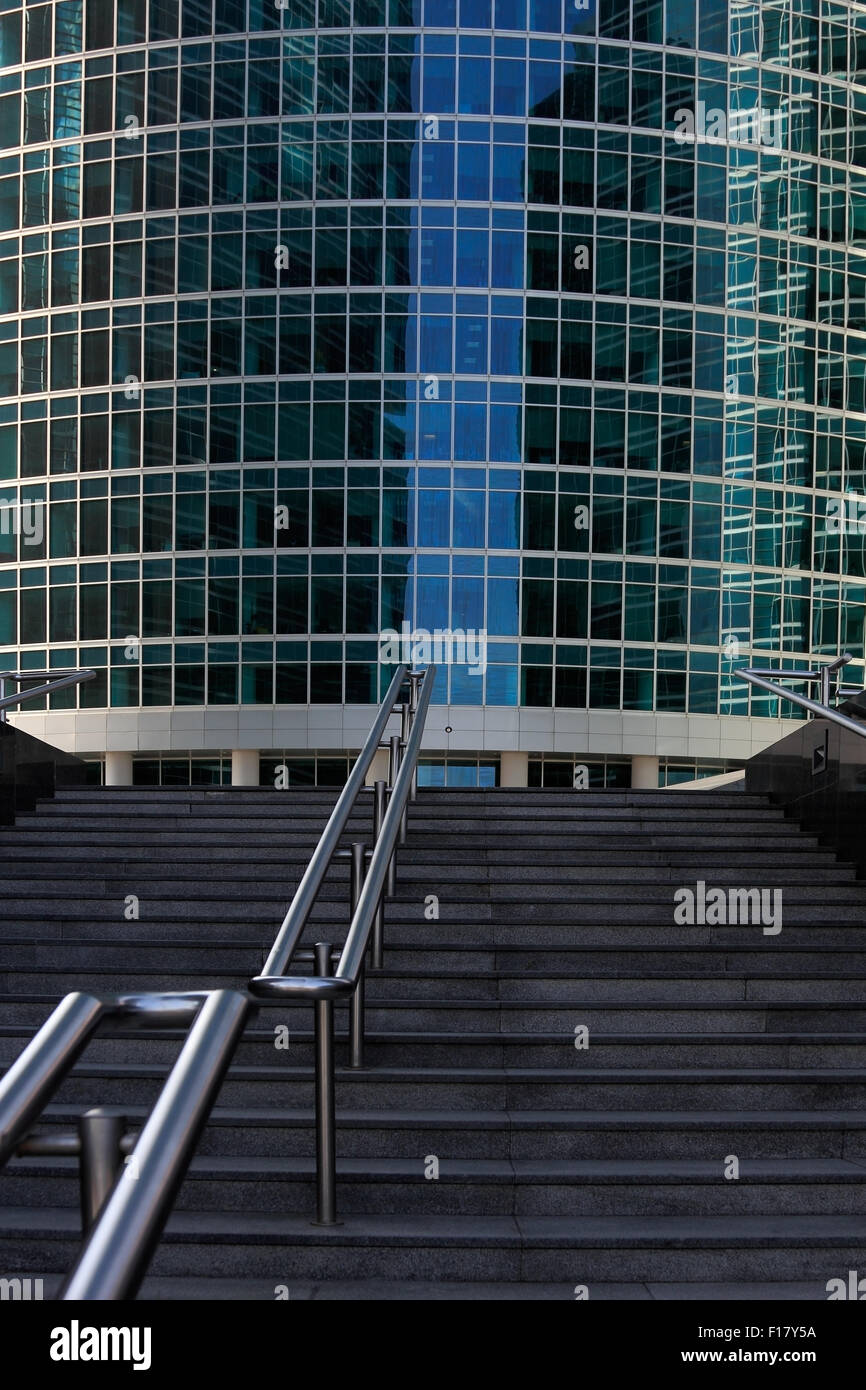Stairway with steel handrails lead up to entrance of office building ...