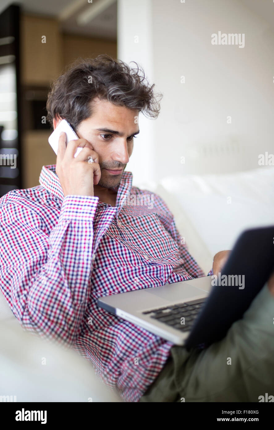 Handsome young man on the mobile phone Stock Photo - Alamy
