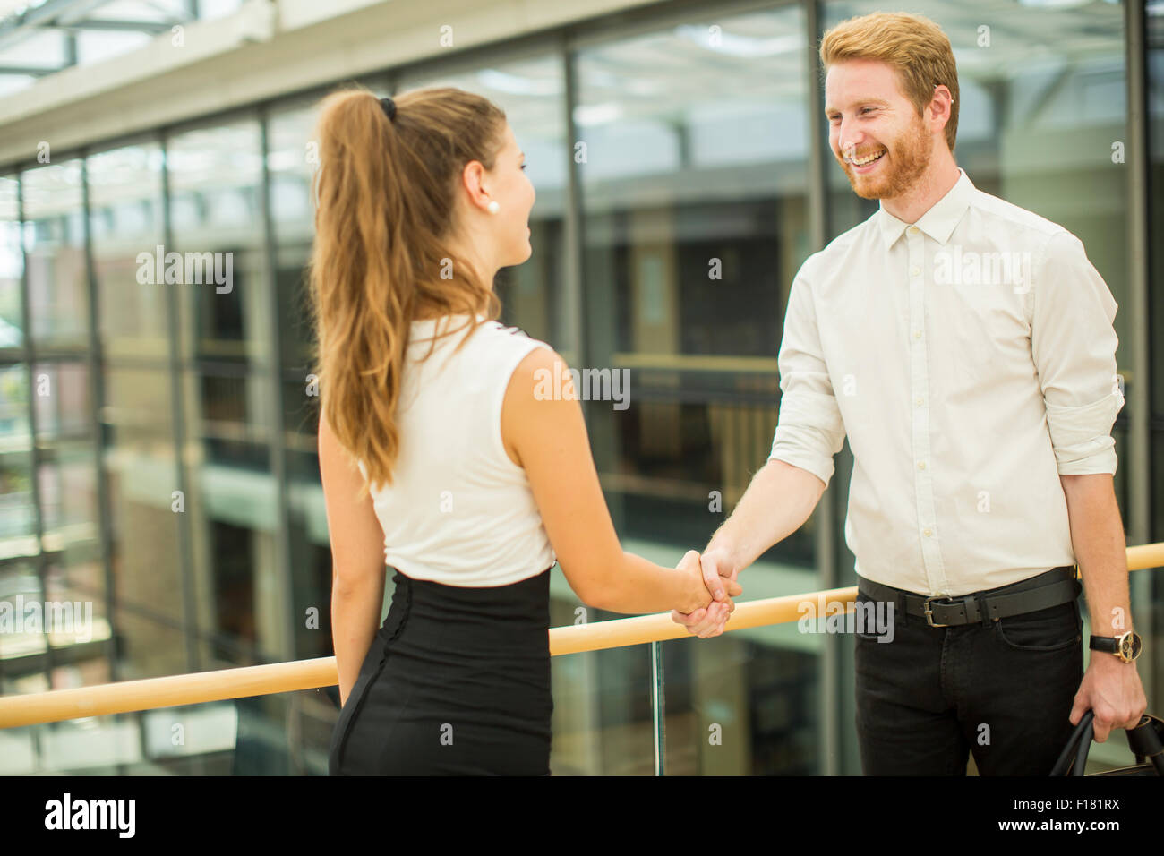 Young people hand shake hi-res stock photography and images - Alamy