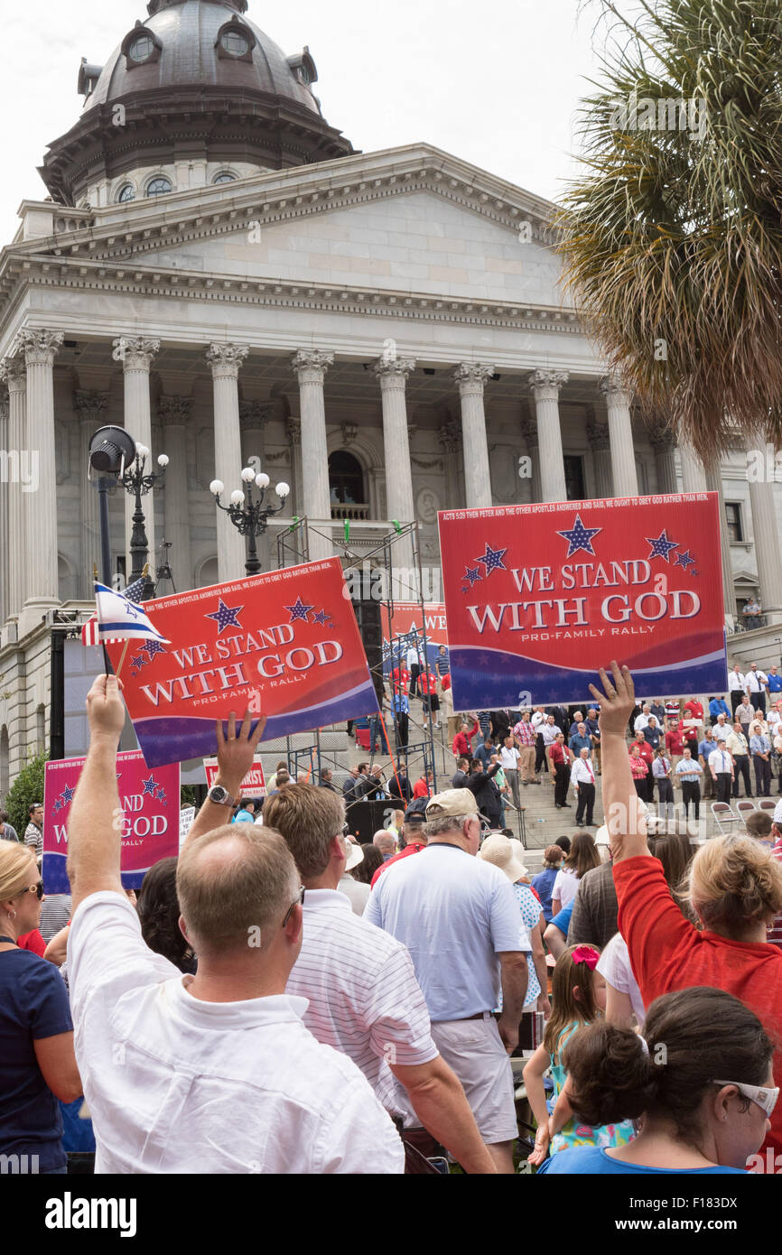 Evangelical Christians wave signs and bibles during the "Stand With God ...