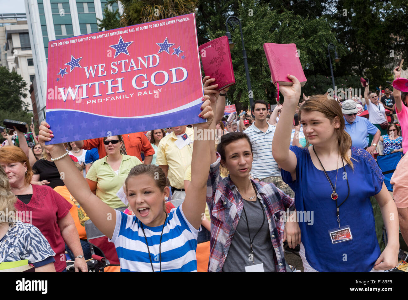 Evangelical Christians wave signs and bibles during the "Stand With God ...