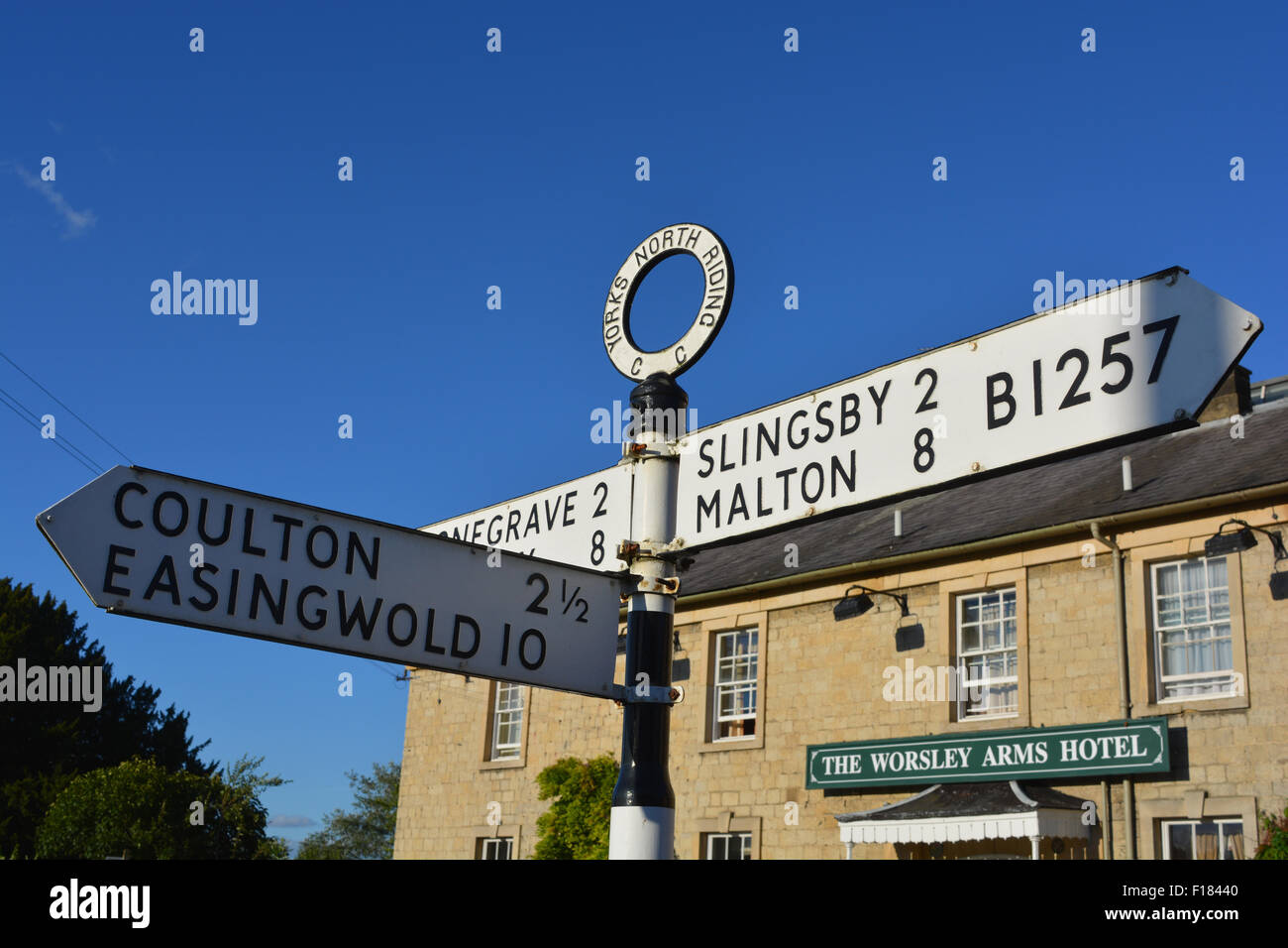 North Riding, York signpost and The Worlsey Arms Hotel, Hovingham ...