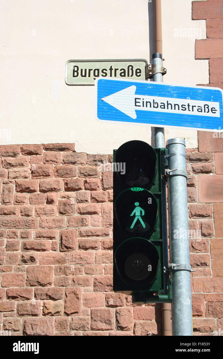 Walk sign, and one way sign, Germany Stock Photo - Alamy