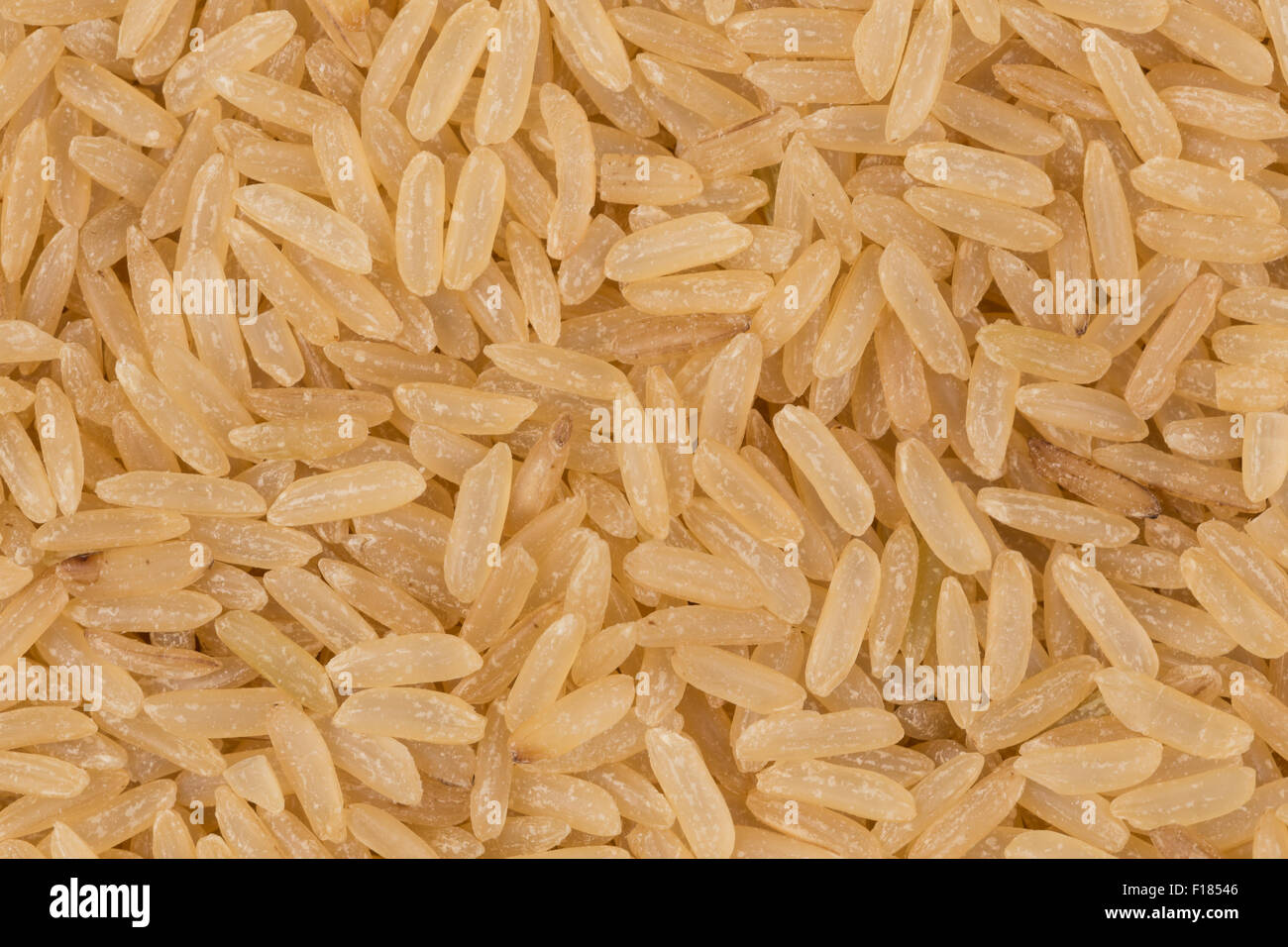 Uncooked Brown rice background close up image Stock Photo - Alamy
