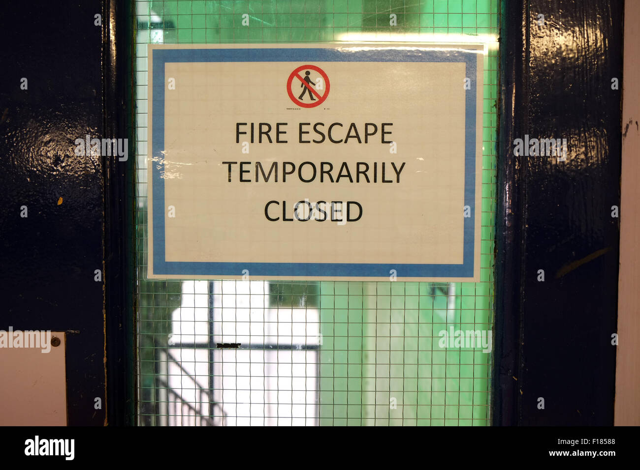 Sign for a closed temporary closed fire escape stair route in an older ...
