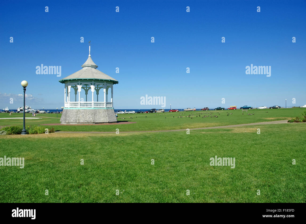 White Gazebo with green grass and blue sky, Cape Cod, Massachusetts ...