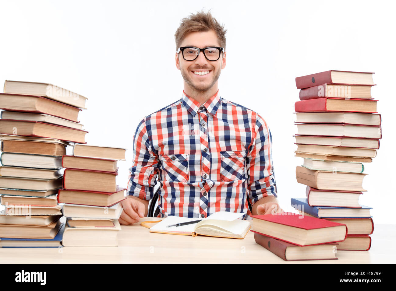 Positive student studying in the library Stock Photo - Alamy