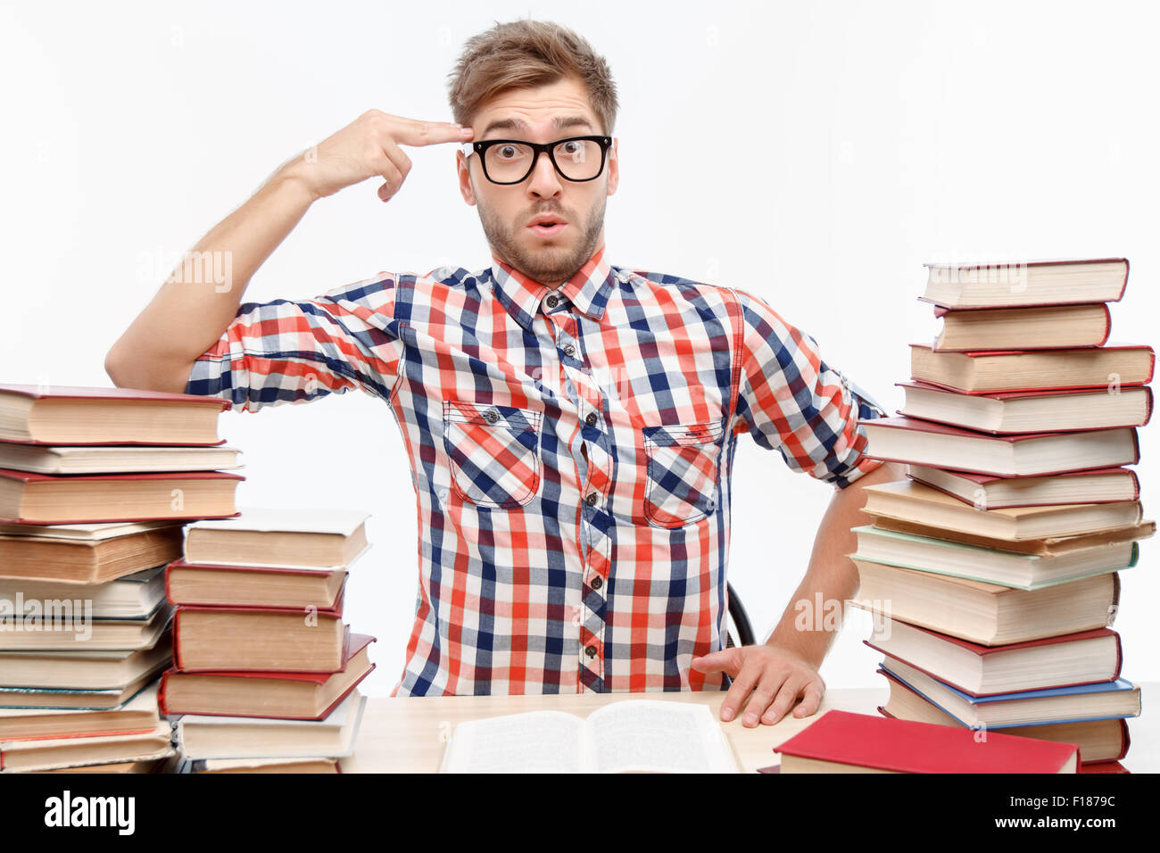 Positive student studying in the library Stock Photo - Alamy