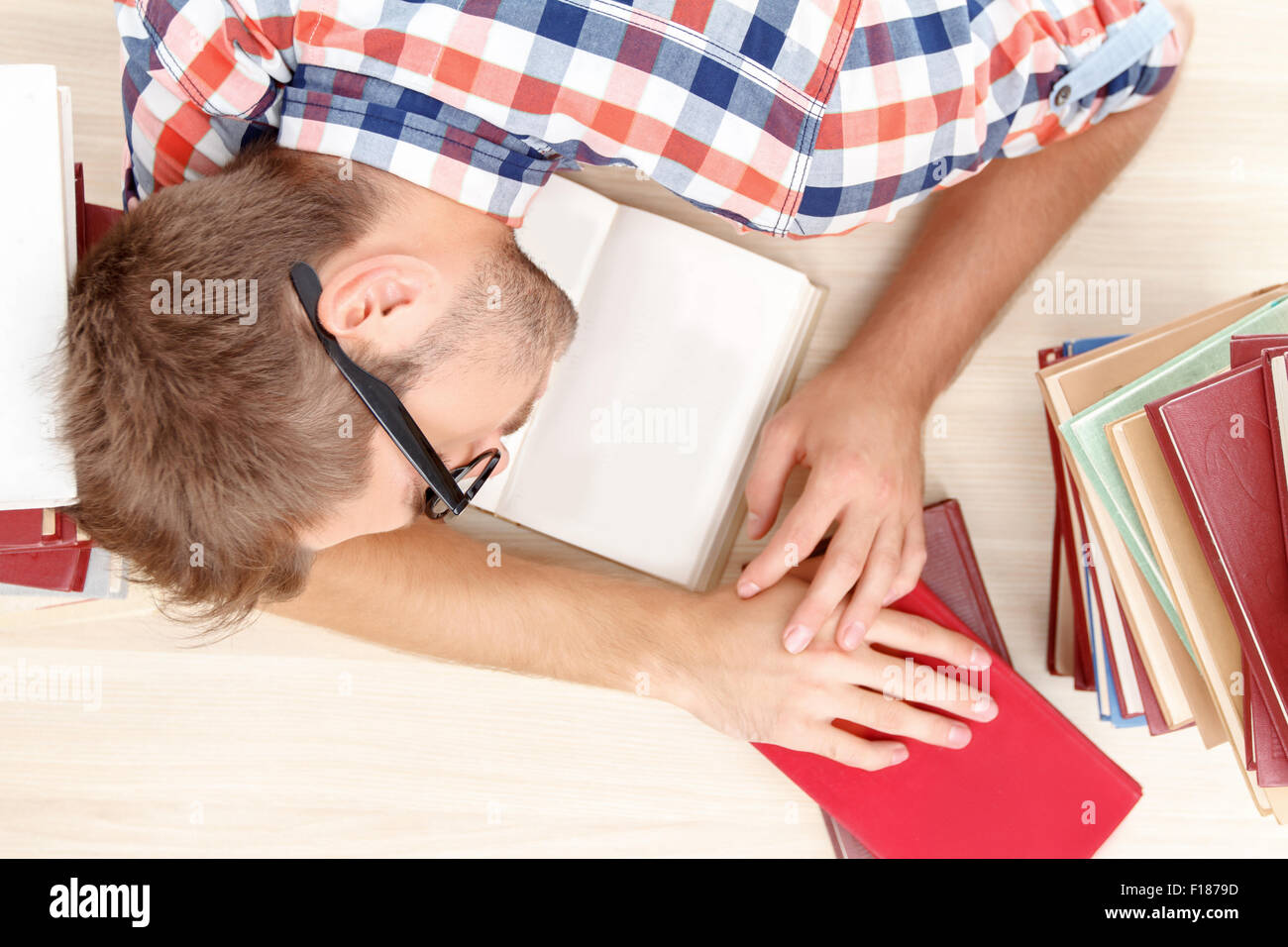 Positive student studying in the library Stock Photo - Alamy