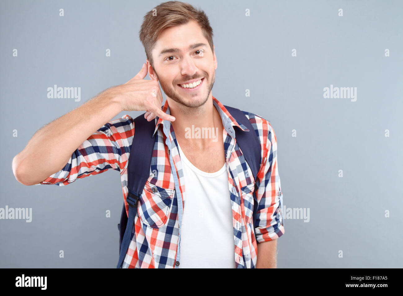 Emotional student raising his hand Stock Photo - Alamy
