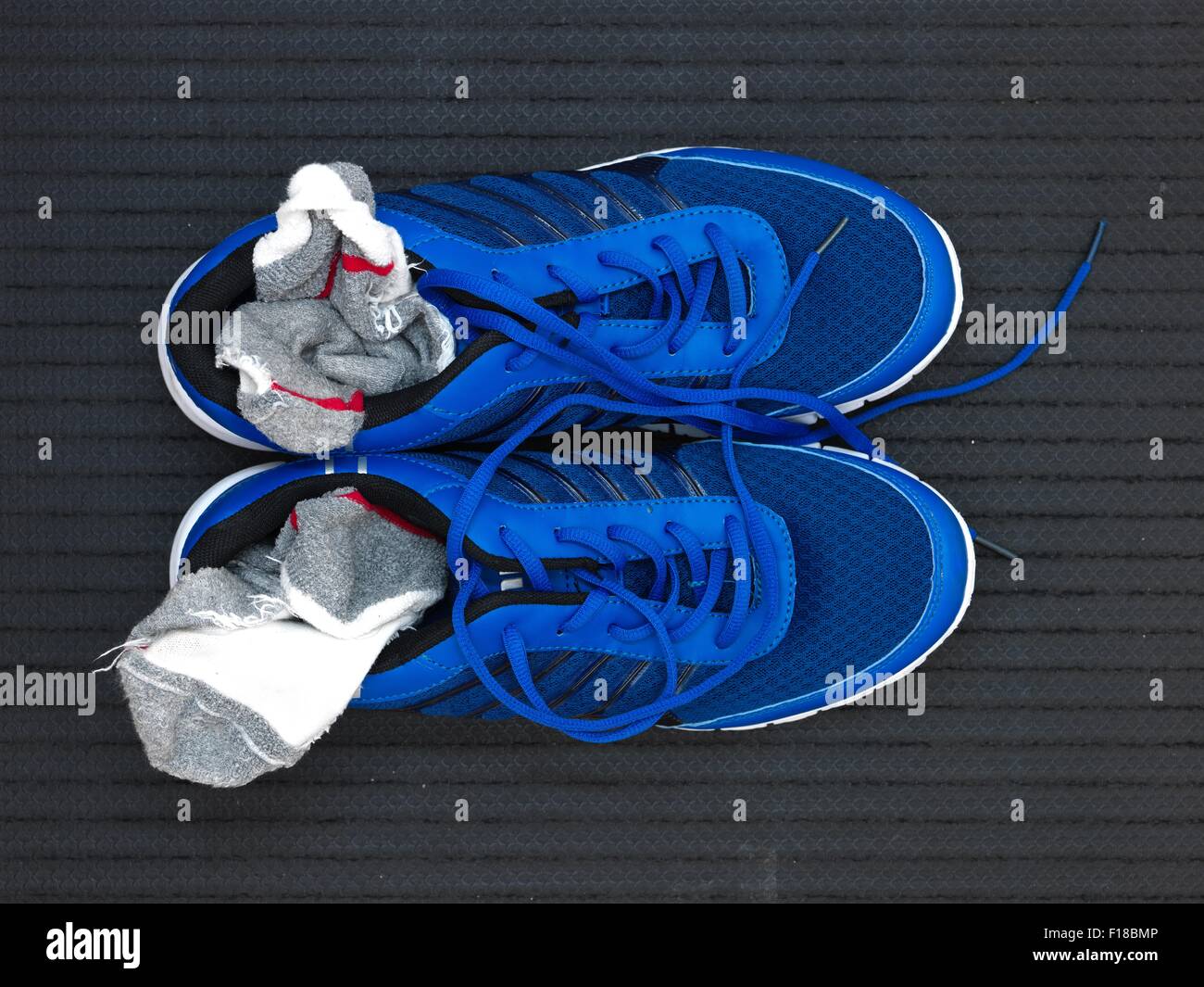 Red running shoe with yellow sole hi-res stock photography and images ...