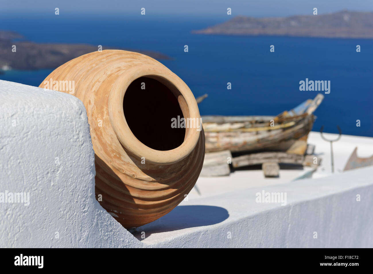 A decorative clay pot on top of a house in Santorini, Greece Stock ...