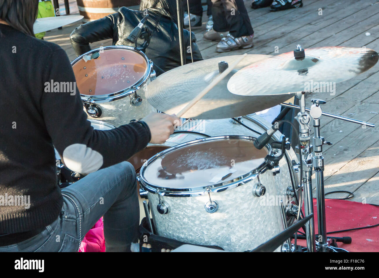 black hair drummer during outdoor concert: rear view Stock Photo - Alamy