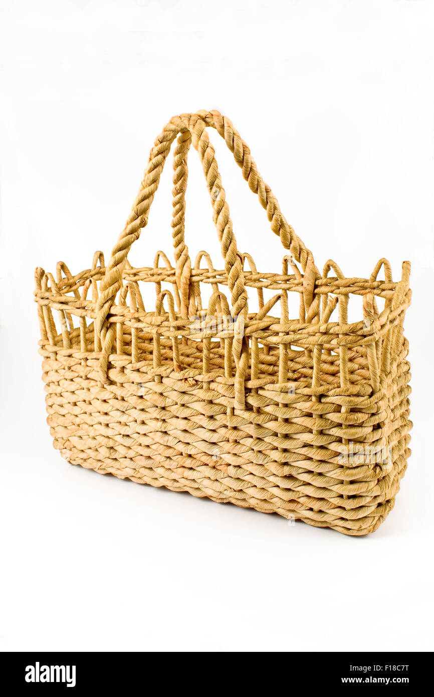 Straw shopping basket isolated on white Stock Photo - Alamy