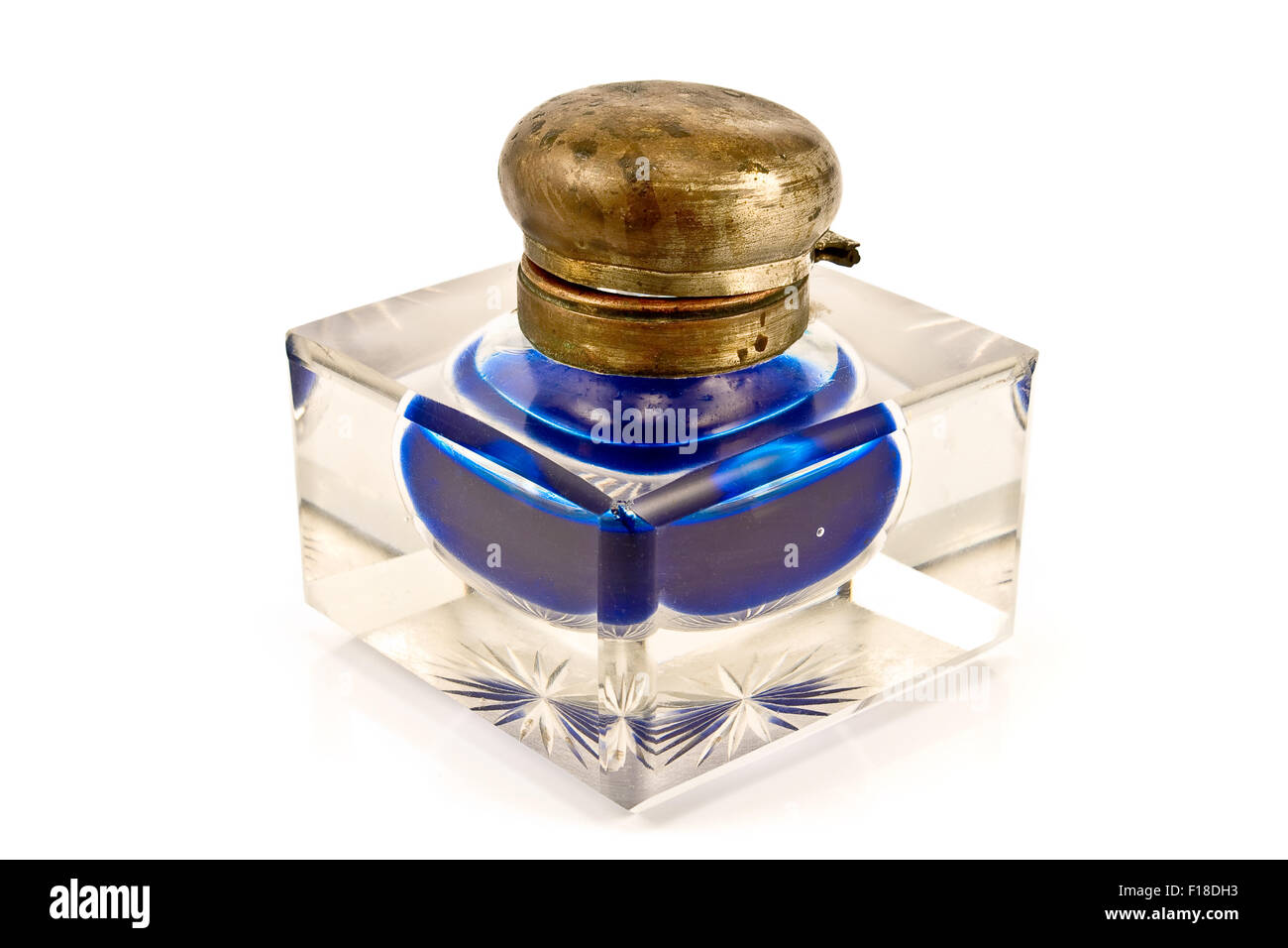 Antique glass inkwell with blue ink isolated on white Stock Photo - Alamy
