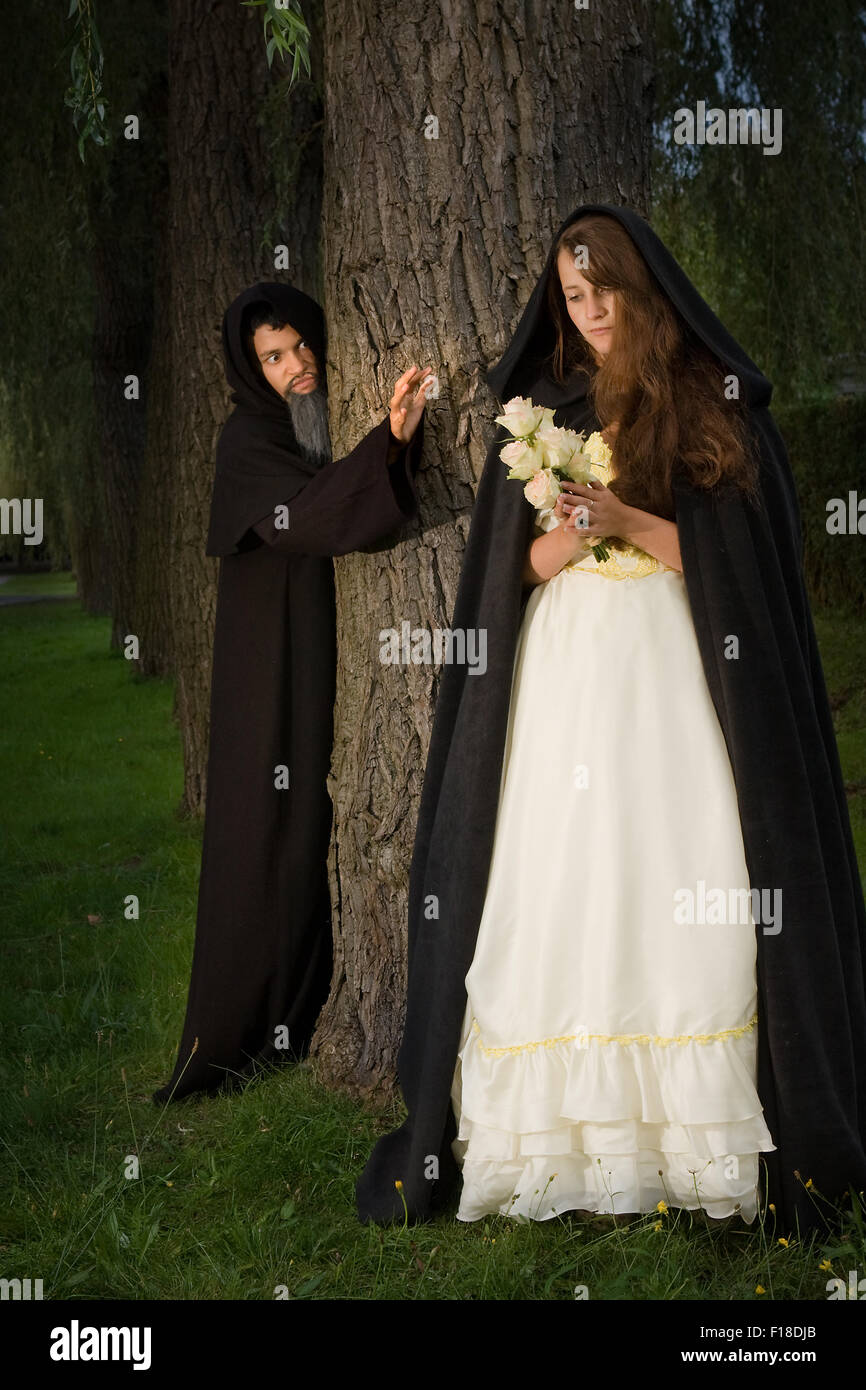 Young innocent woman in the woods threatened by an evil monk Stock ...