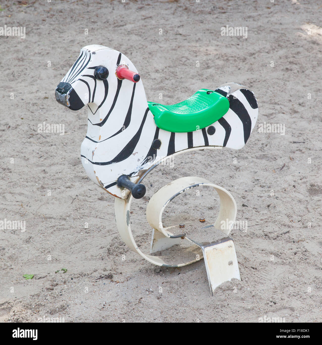 Old spring zebra, outdoor toy for children Stock Photo - Alamy