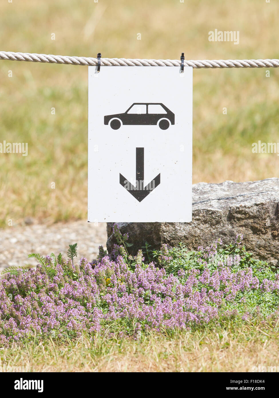 Car parking sign hanging on a rope Stock Photo - Alamy