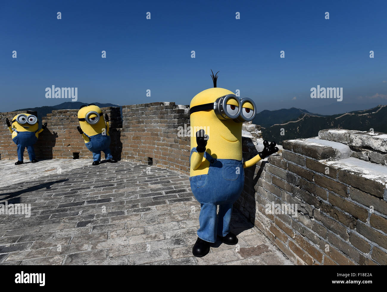Beijing, China. 29th Aug, 2015. Minions look outside the Great Wall in ...