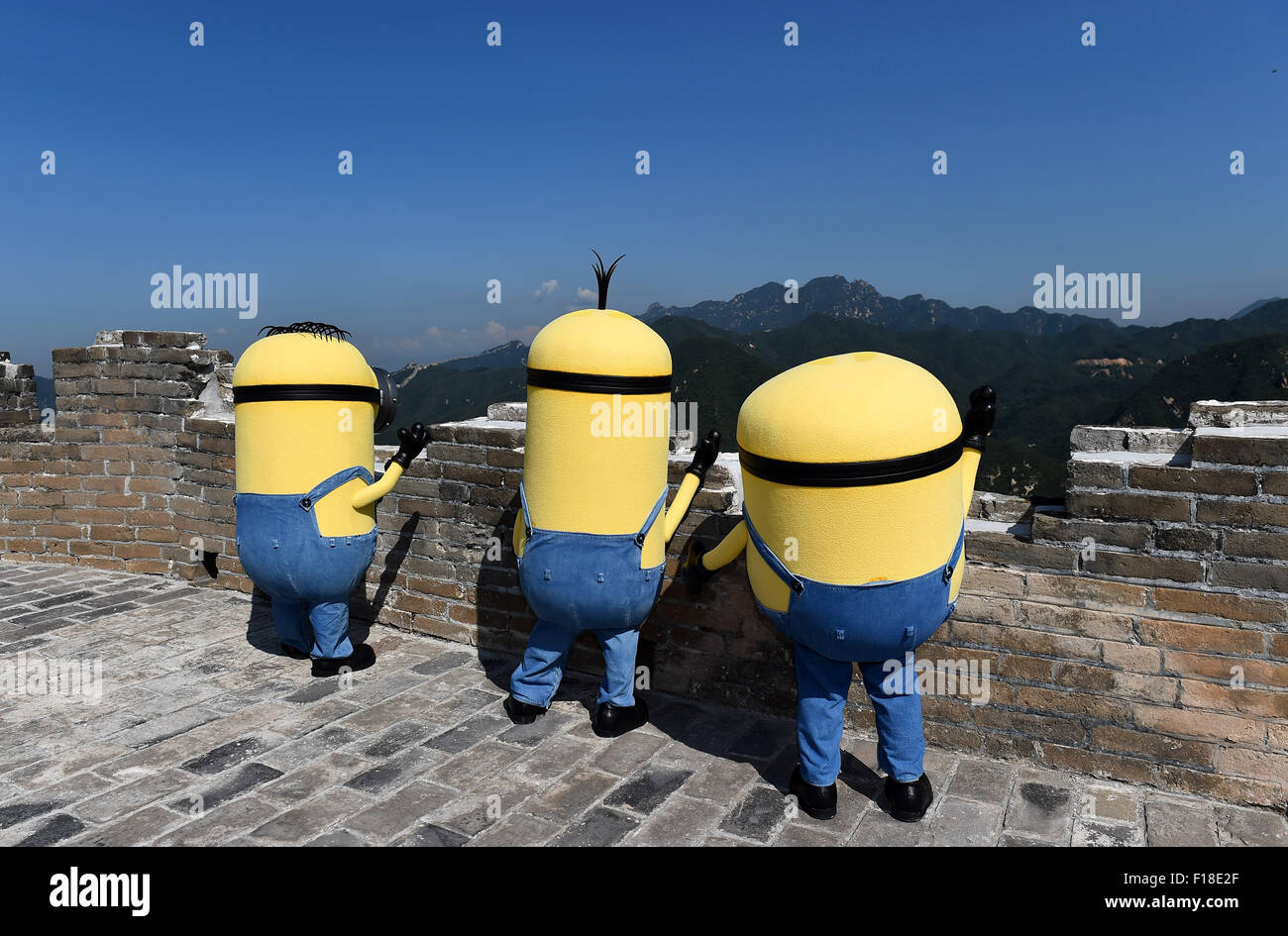 Beijing, China. 29th Aug, 2015. Minions look outside the Great Wall in ...