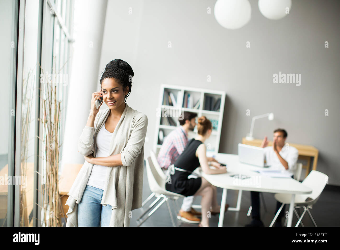 Pretty office employee holding hi-res stock photography and images - Alamy