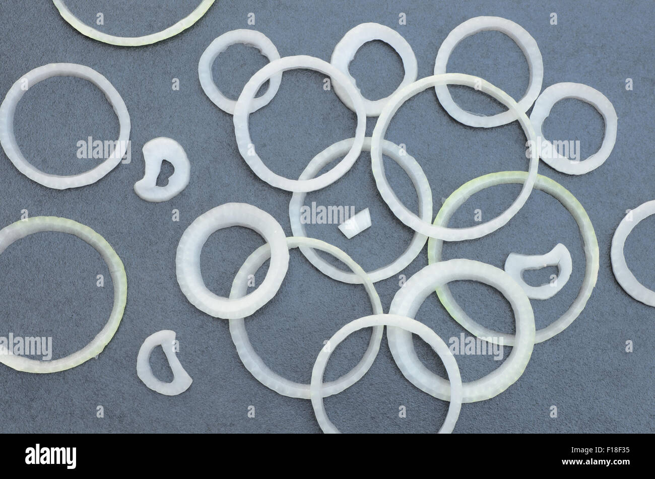 raw white onion rings on table Stock Photo - Alamy