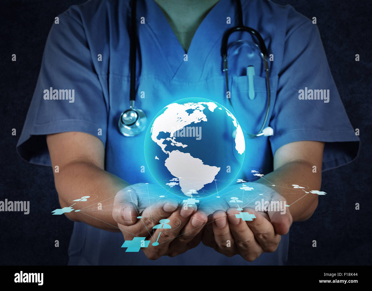 Medical Doctor holding a world globe in his hands as medical network ...
