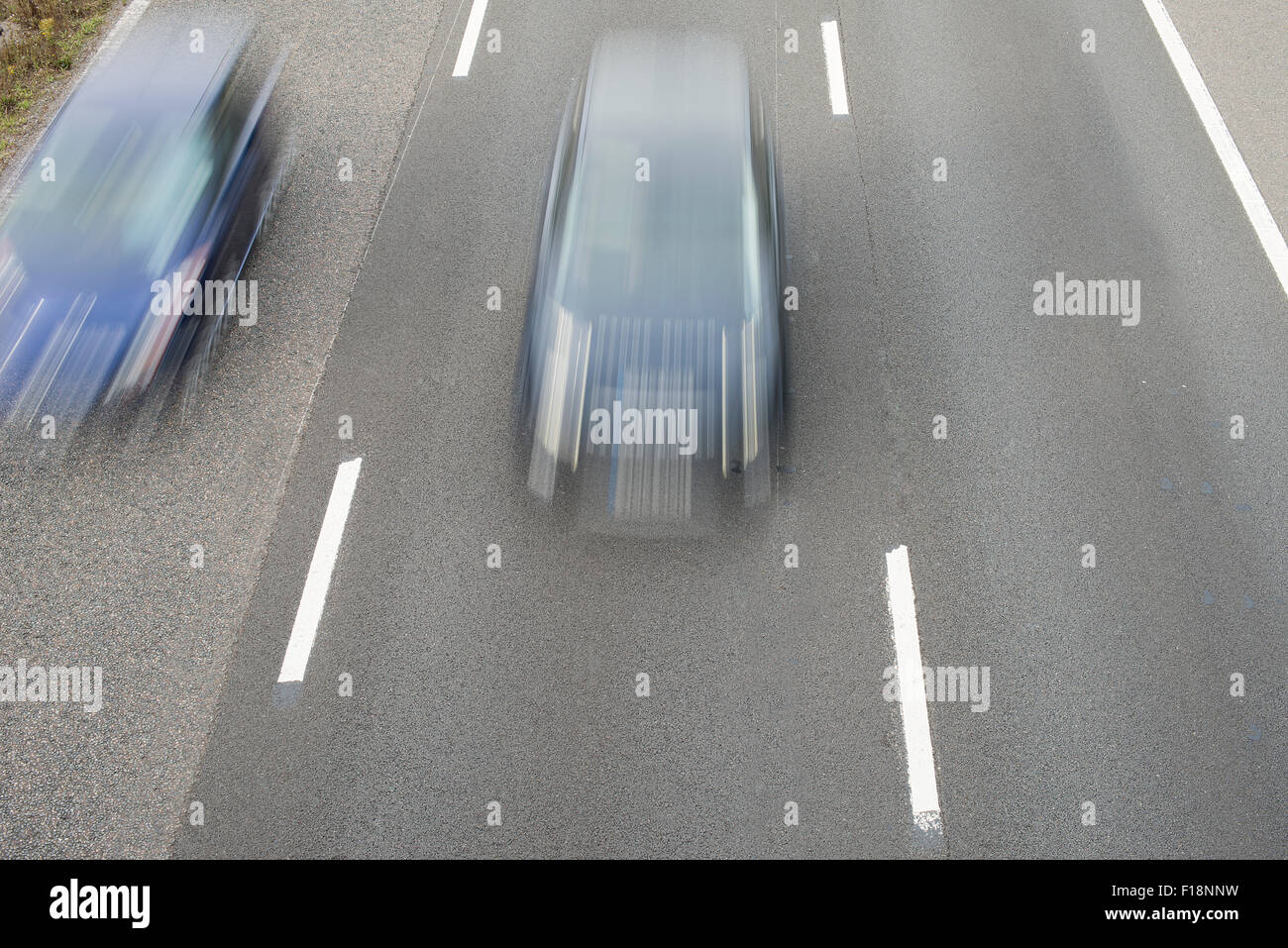 Overhead view, of two speeding cars on the motorway Stock Photo - Alamy