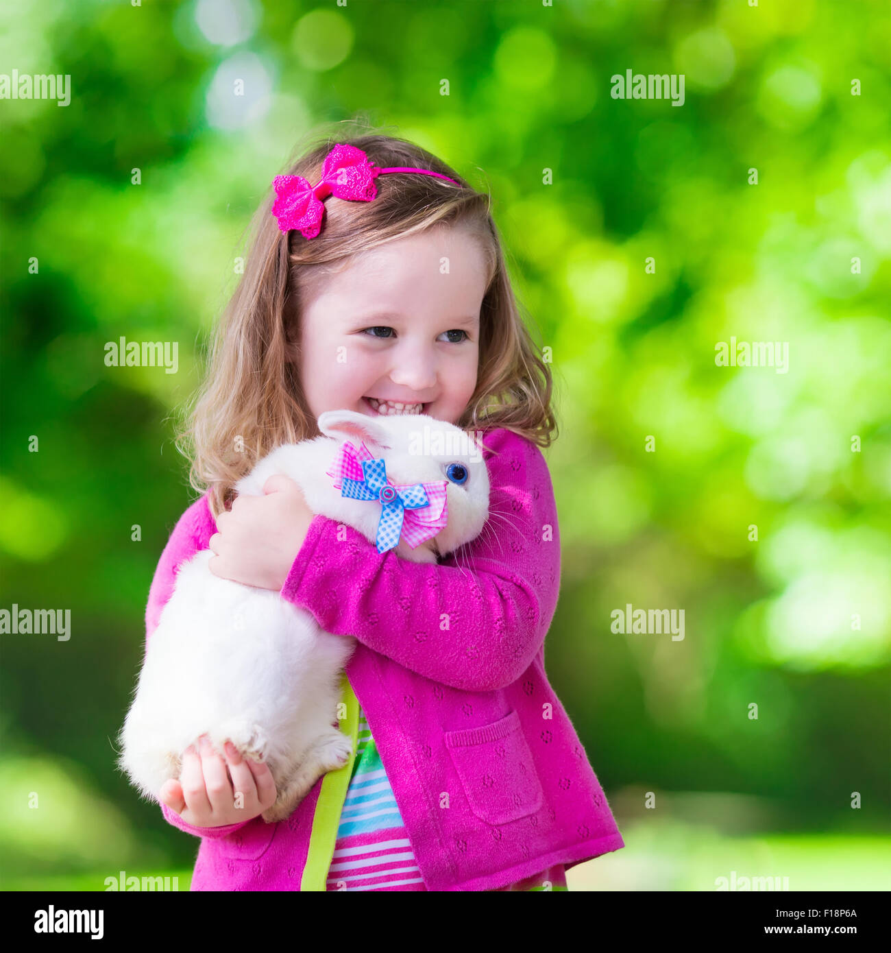 Child playing real rabbit kids hi-res stock photography and images - Alamy