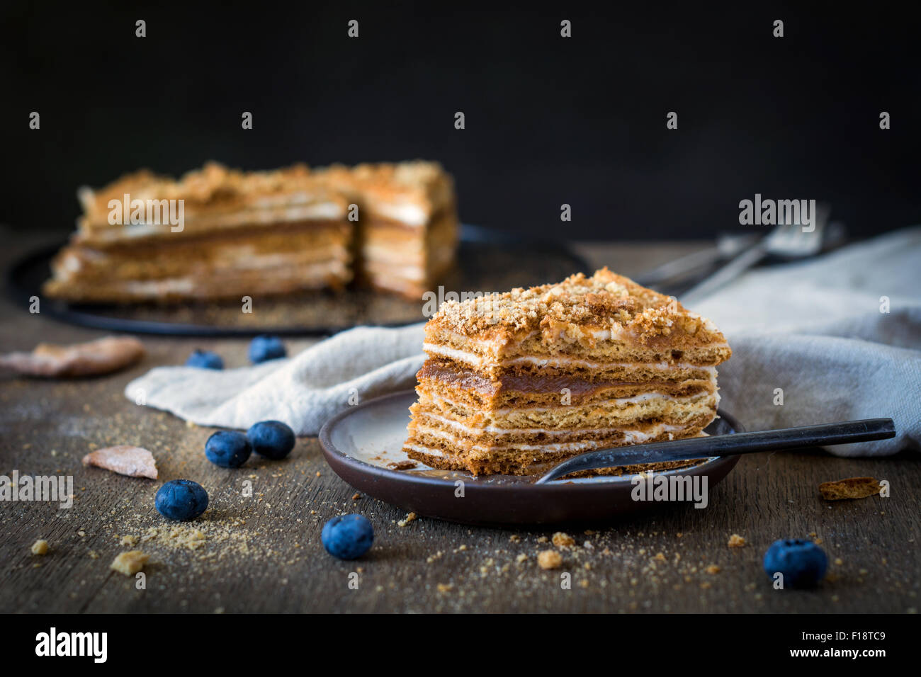 Slice of homemade medovik (layered honey cake, traditional russian cake ...