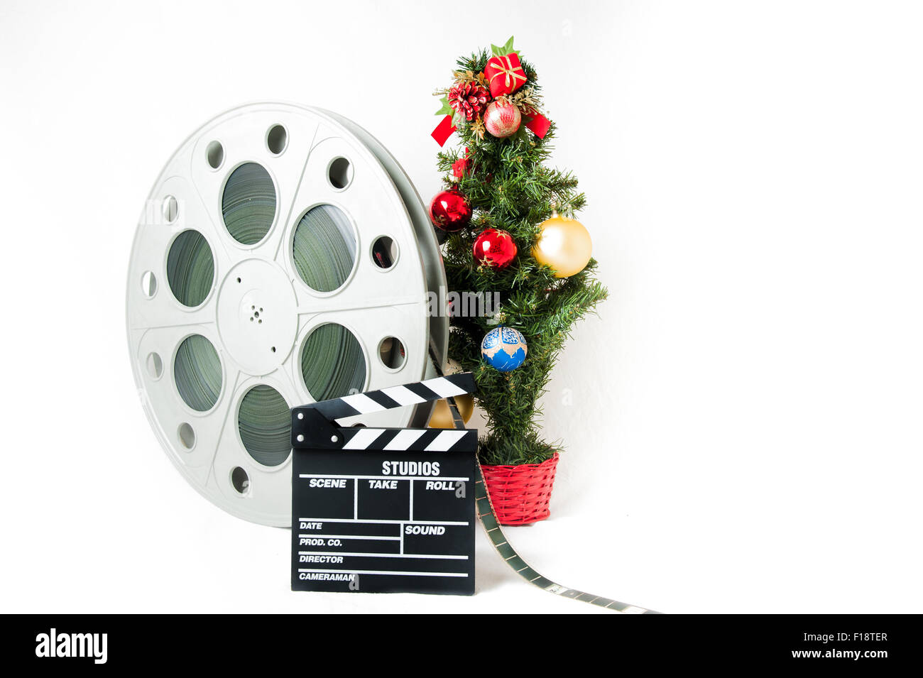 Movie clapper board and reel with christmas tree Stock Photo - Alamy