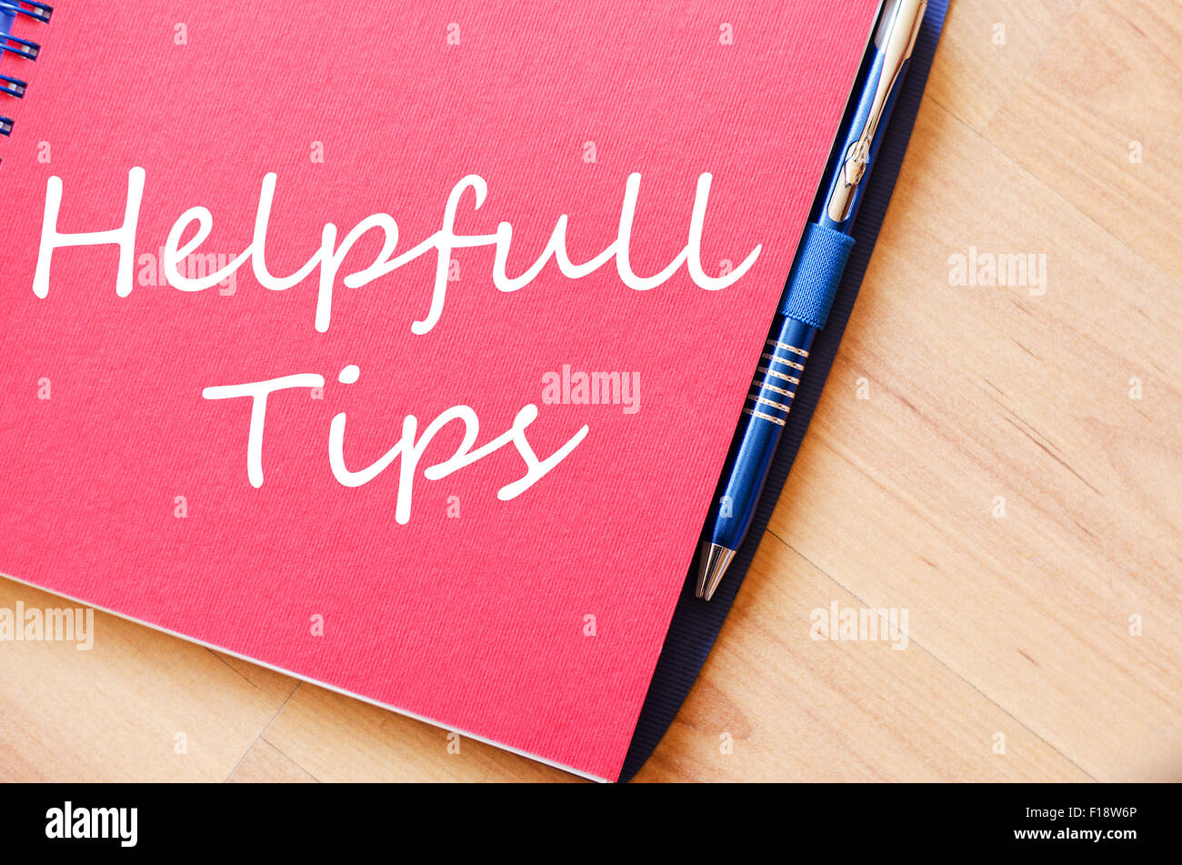 Red notepad and Helpful tips text concept Stock Photo - Alamy