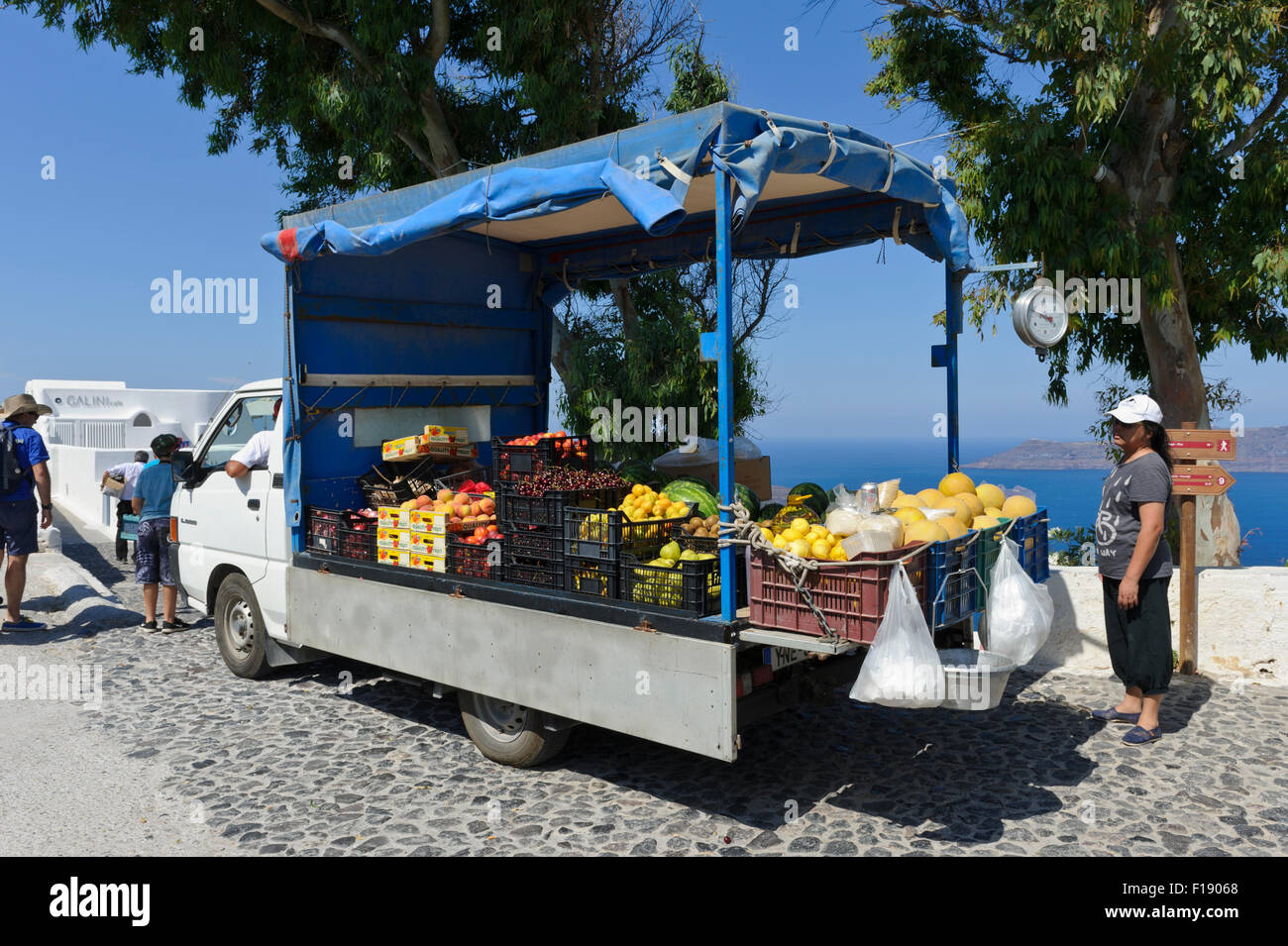 A mobile market at the back of a lorry selling fresh vegetables and ...