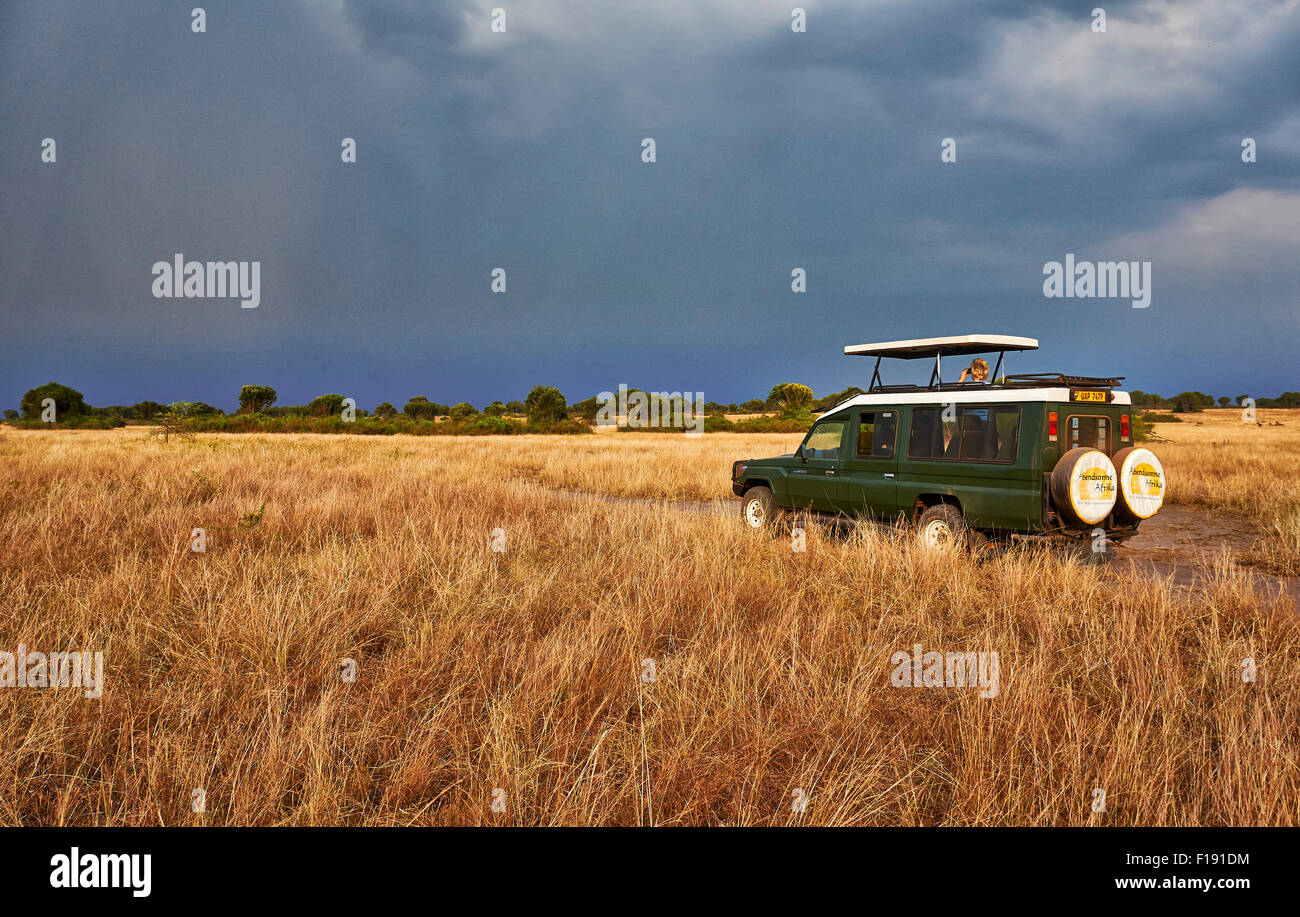 4x4 tourist vehicle in landscape in Queen Elizabeth National Park ...