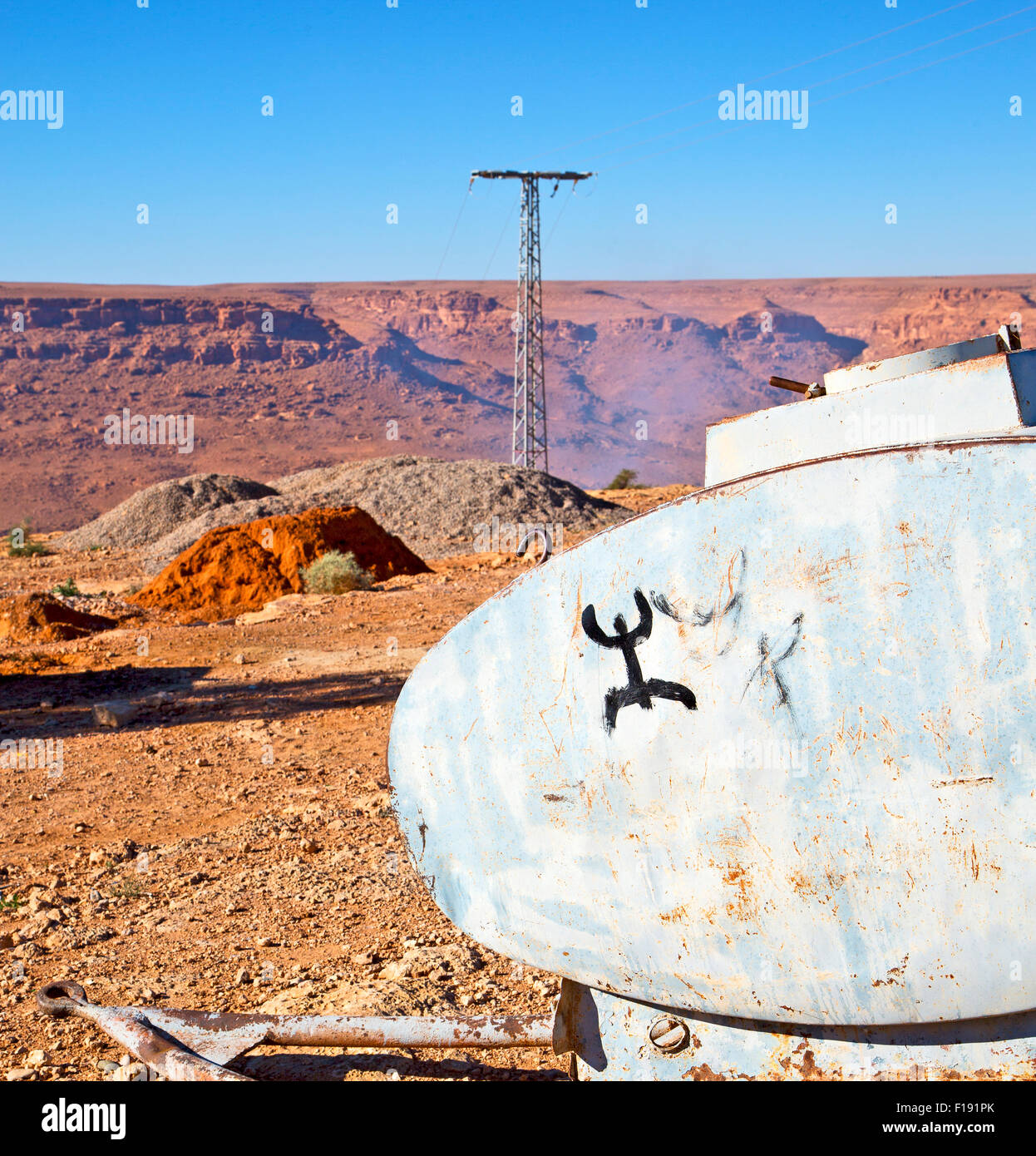 water tank in morocco africa land gray metal weel and arid Stock Photo ...